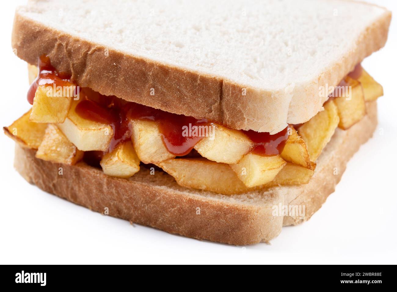 Traditional British chip butty (french fry sandwich) isolated on white ...