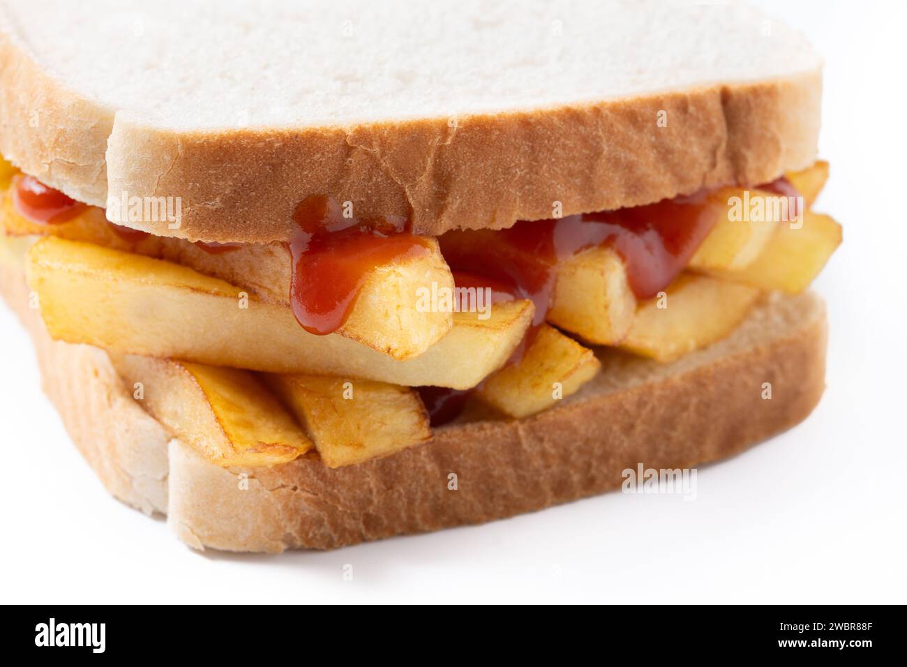 Traditional British chip butty (french fry sandwich) isolated on white ...