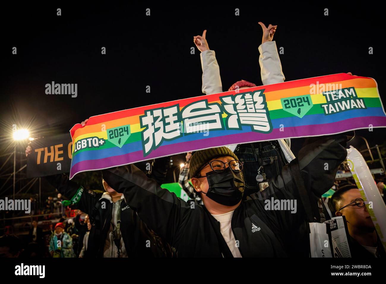 Taipei, Taiwan. 11th Jan, 2024. Supporters hold a banner written “LGBTQ ...