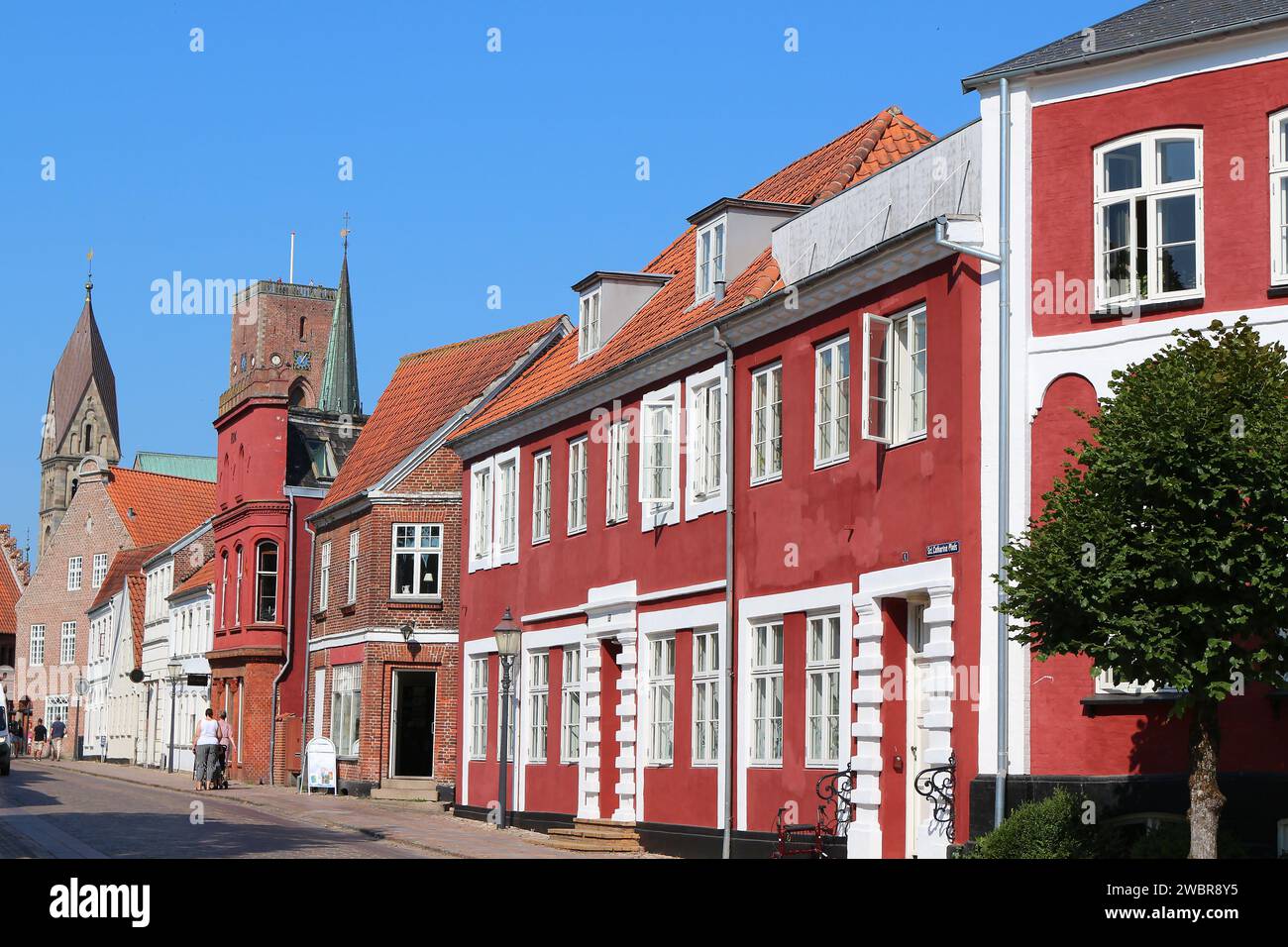 Street with red historic houses in the medieval town Ribe, Denmark ...
