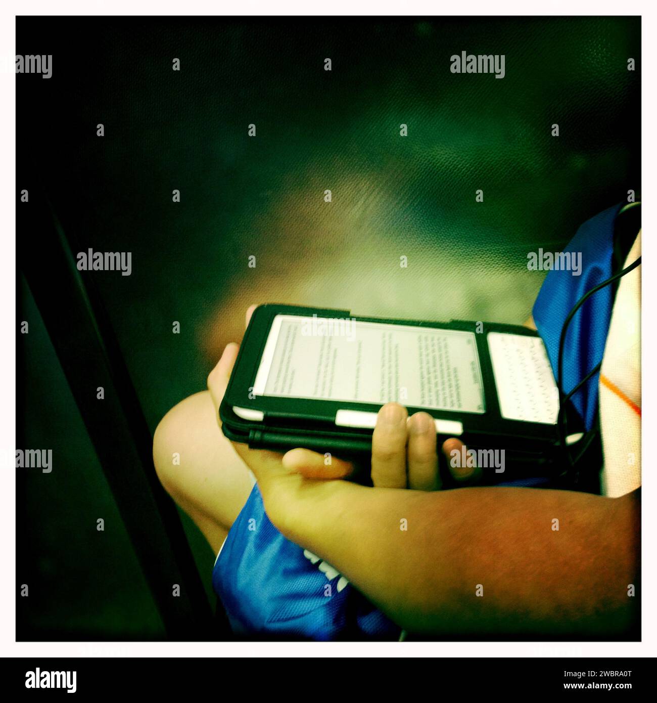 Reading on a Kindle Stock Photo - Alamy