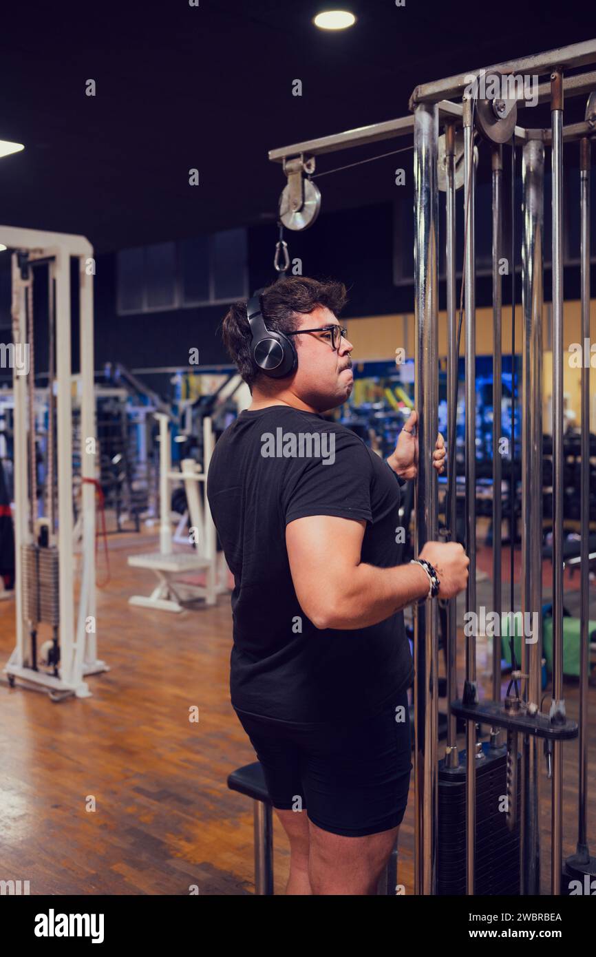 A person is intensely focused on lifting weights at the gym Stock Photo ...