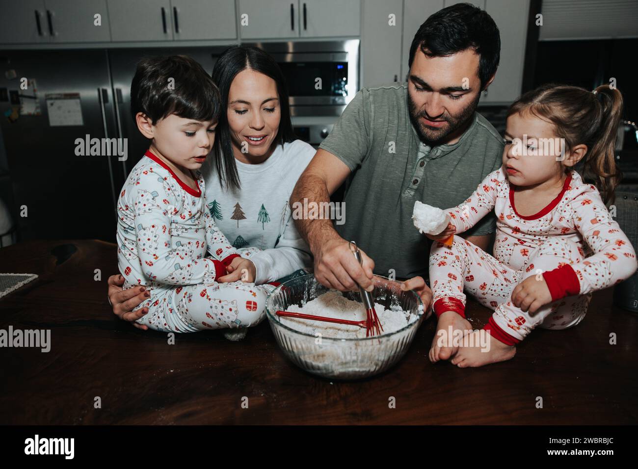 Family preps for baking fun Stock Photo - Alamy