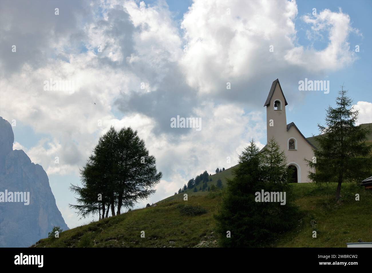 Dolomite's landscape and church of Passo Gardena Stock Photo - Alamy