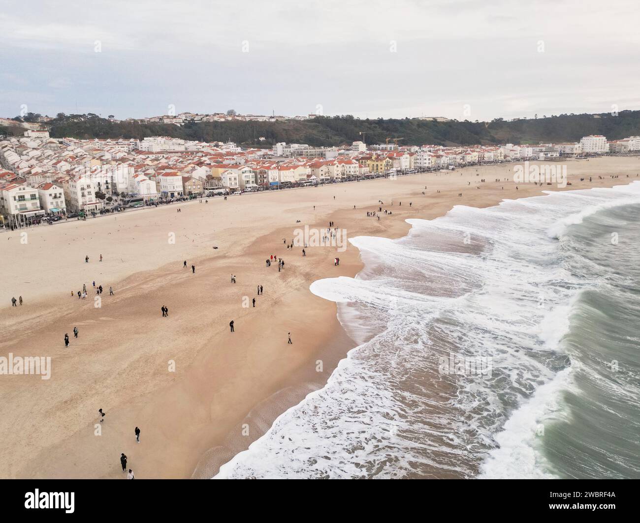 Big Wave Surf Tourism Hot Spot Nazare in Portugal on a cloudy day with ...