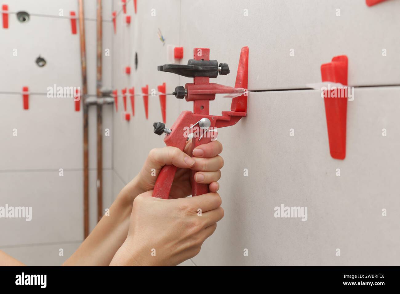 Tiles bathroom laying woman hi-res stock photography and images - Alamy