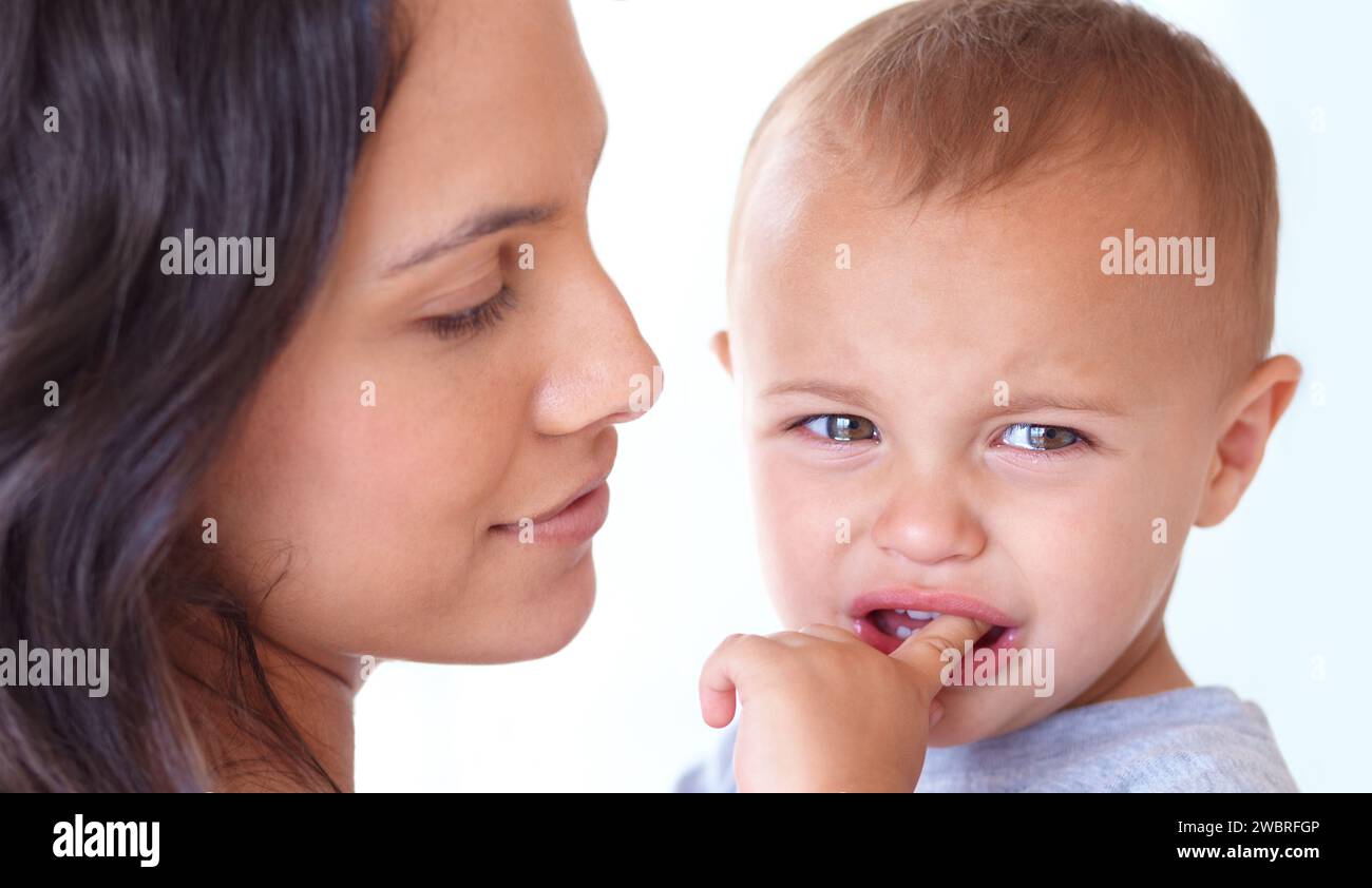 Family, crying and mother with baby on a white background for bonding ...