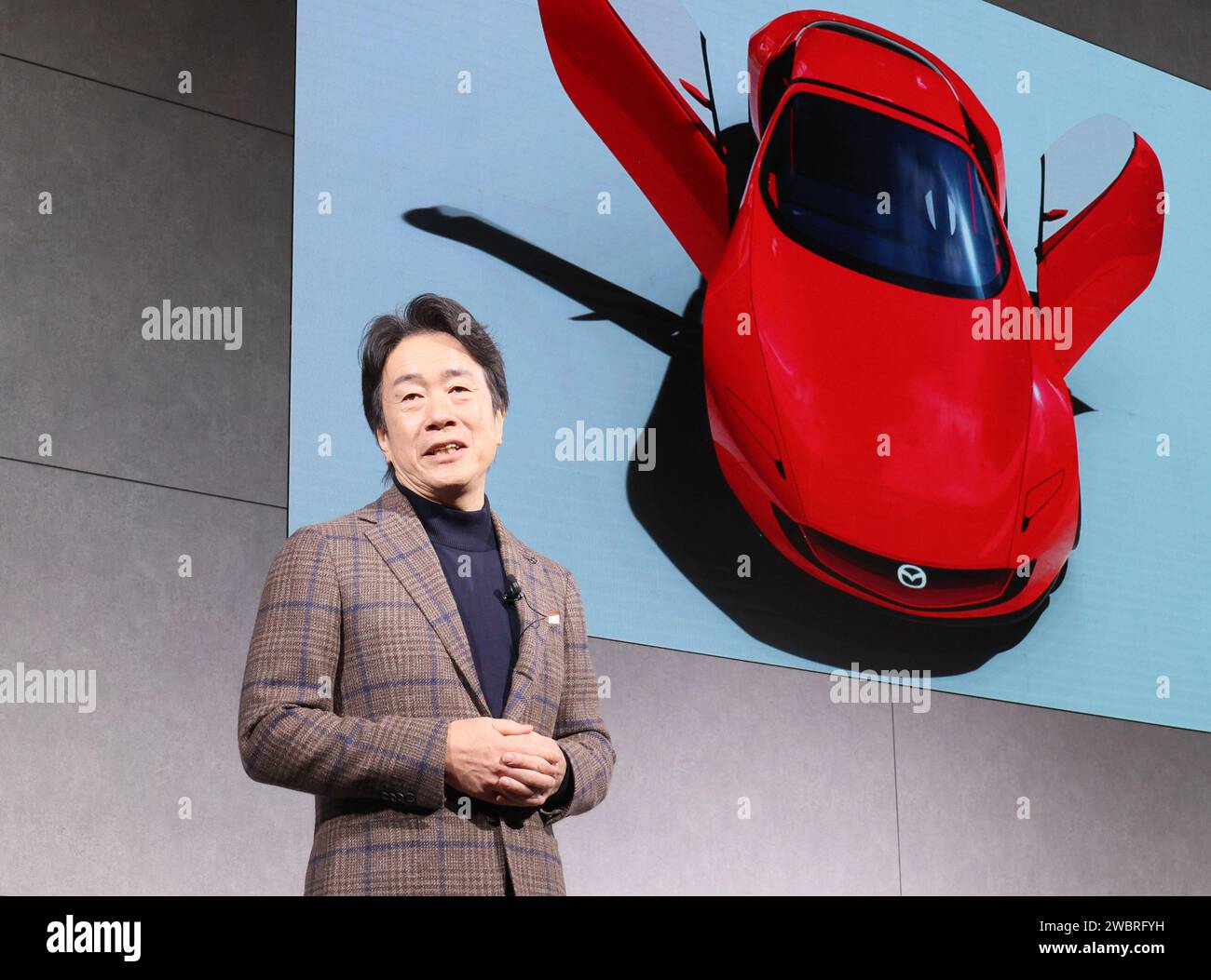 Chiba, Japan. 12th Jan, 2024. Japanese automaker Mazda Motor president Masahiro Moro delivers a ...