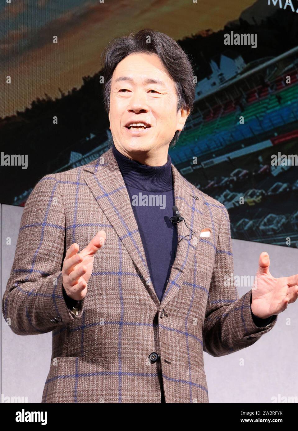 Chiba, Japan. 12th Jan, 2024. Japanese automaker Mazda Motor president Masahiro Moro delivers a ...