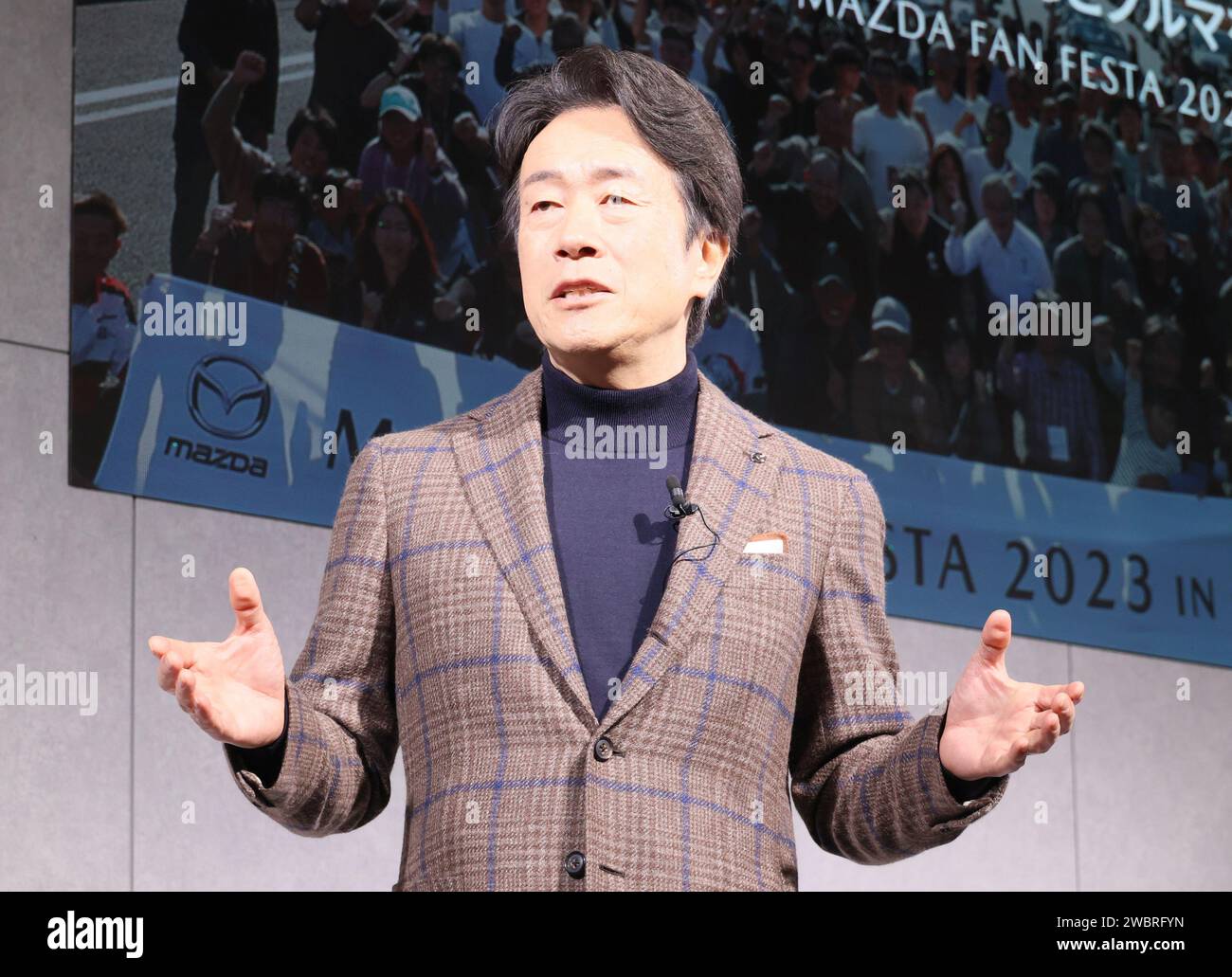 Chiba, Japan. 12th Jan, 2024. Japanese automaker Mazda Motor president Masahiro Moro delivers a ...