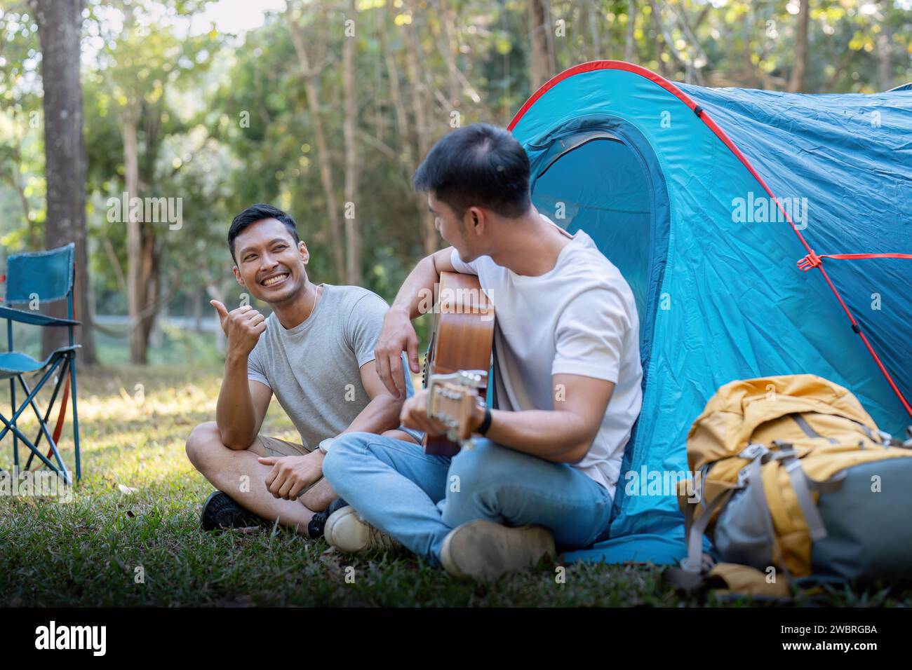 Male gay couple asian traveling with tent camping outdoor and various ...