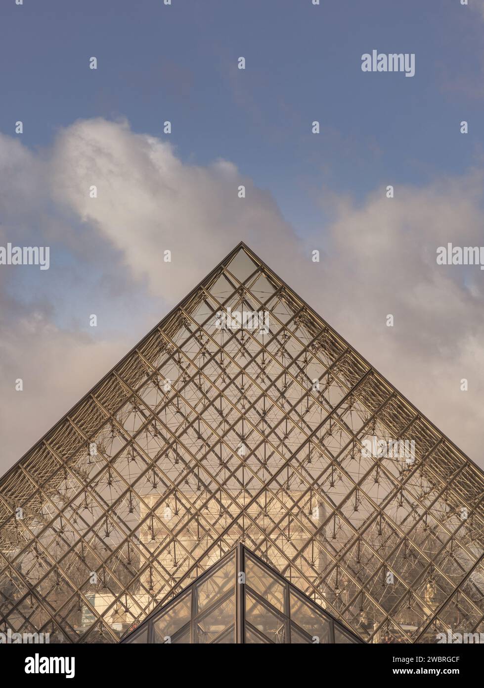 France, Paris - Jan 03, 2024 - Geometrical forms of Glass pyramid with ...