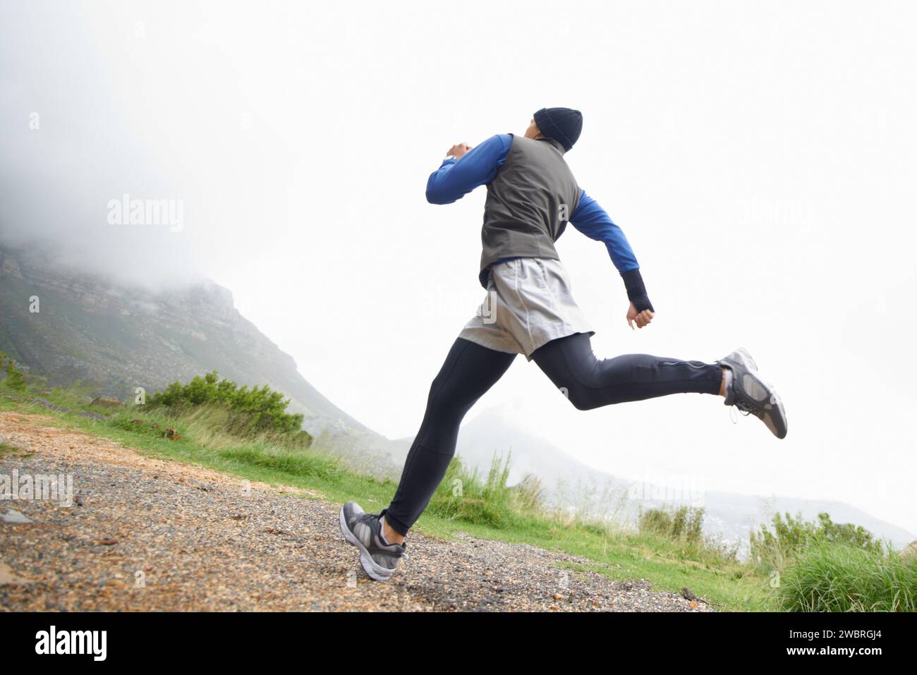 Low angle, fitness and man running in nature training, cardio exercise ...