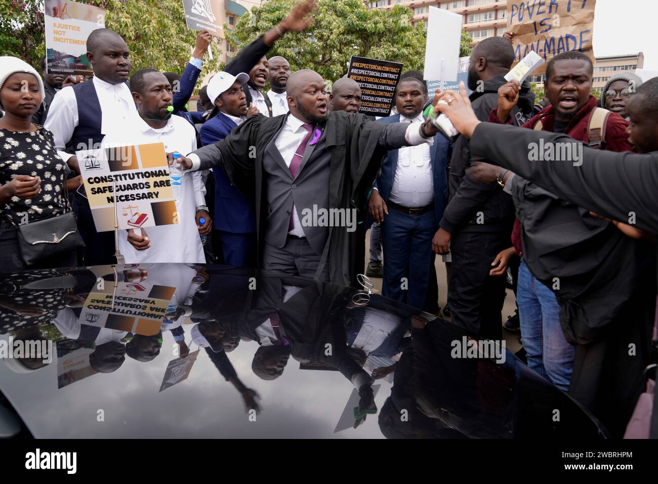 Human rights activists and members of the Law Society of Kenya hold a ...