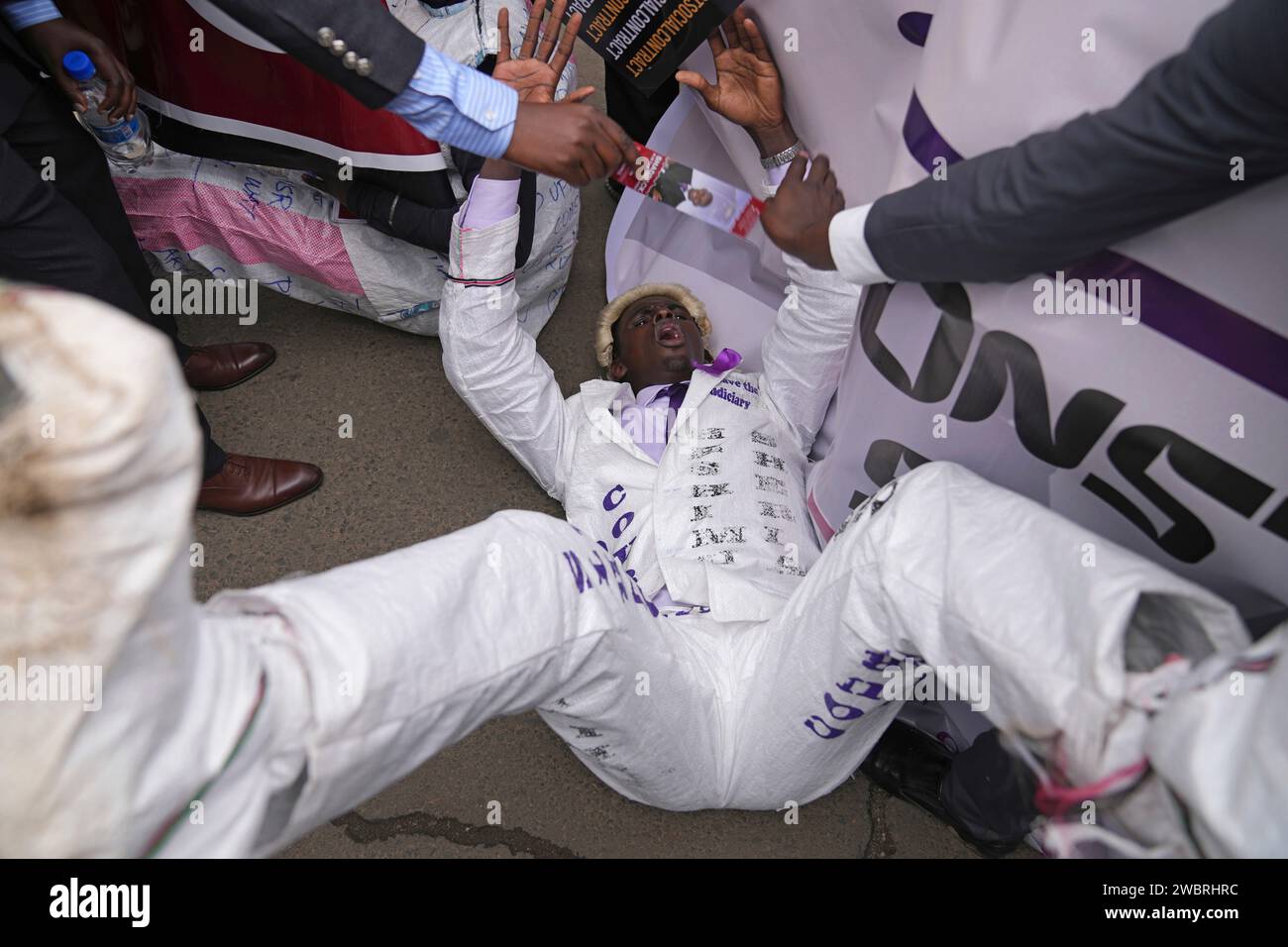 Human rights activists and members of the Law Society of Kenya hold a ...