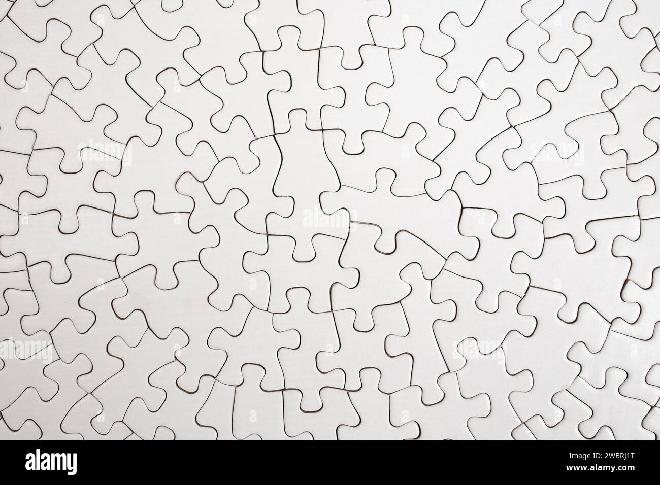 Plain white radial jigsaw puzzle solved, abstract texture close up ...