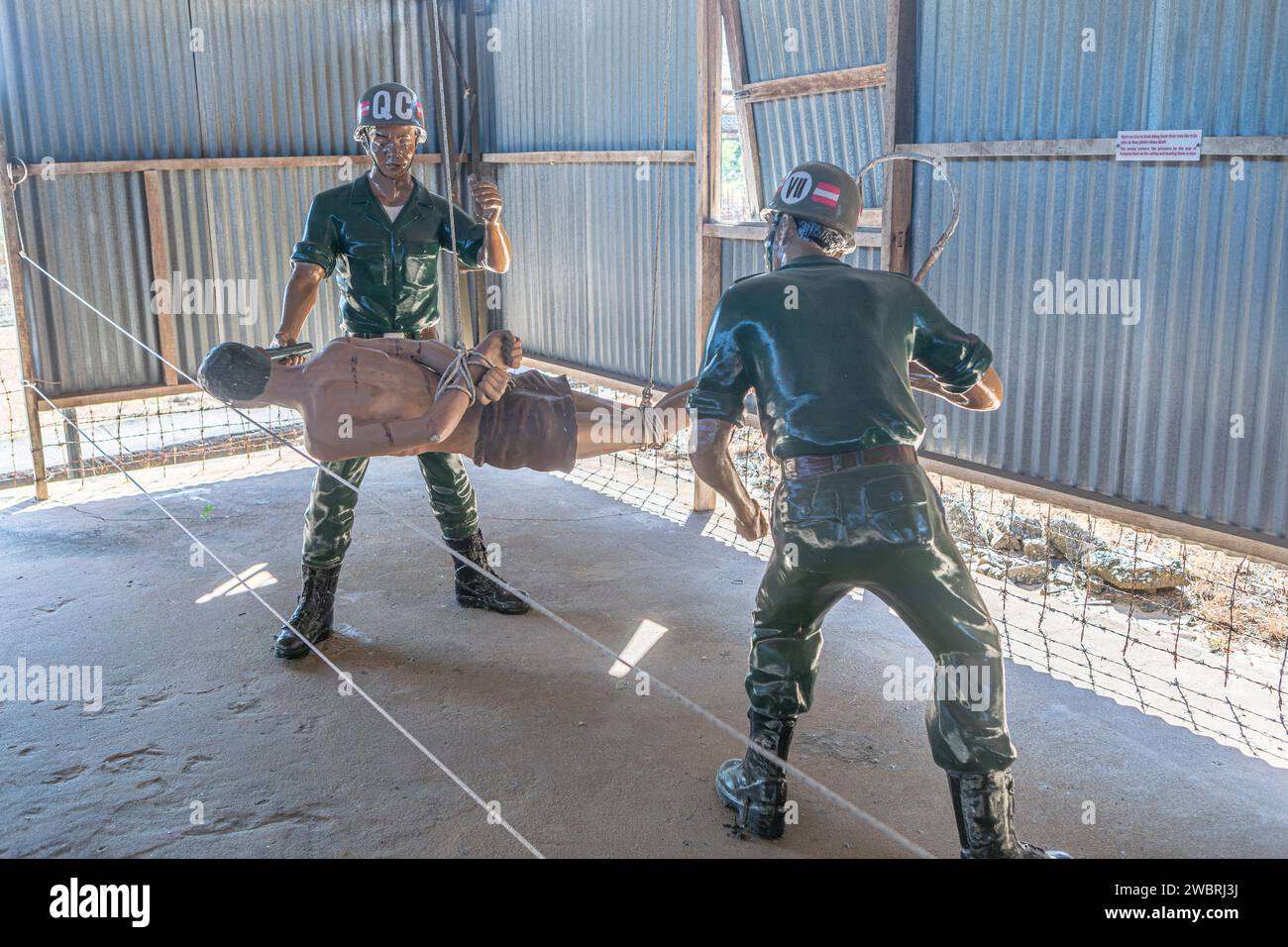 Models of men being beaten at Phu Quoc Coconut Prison. A military ...