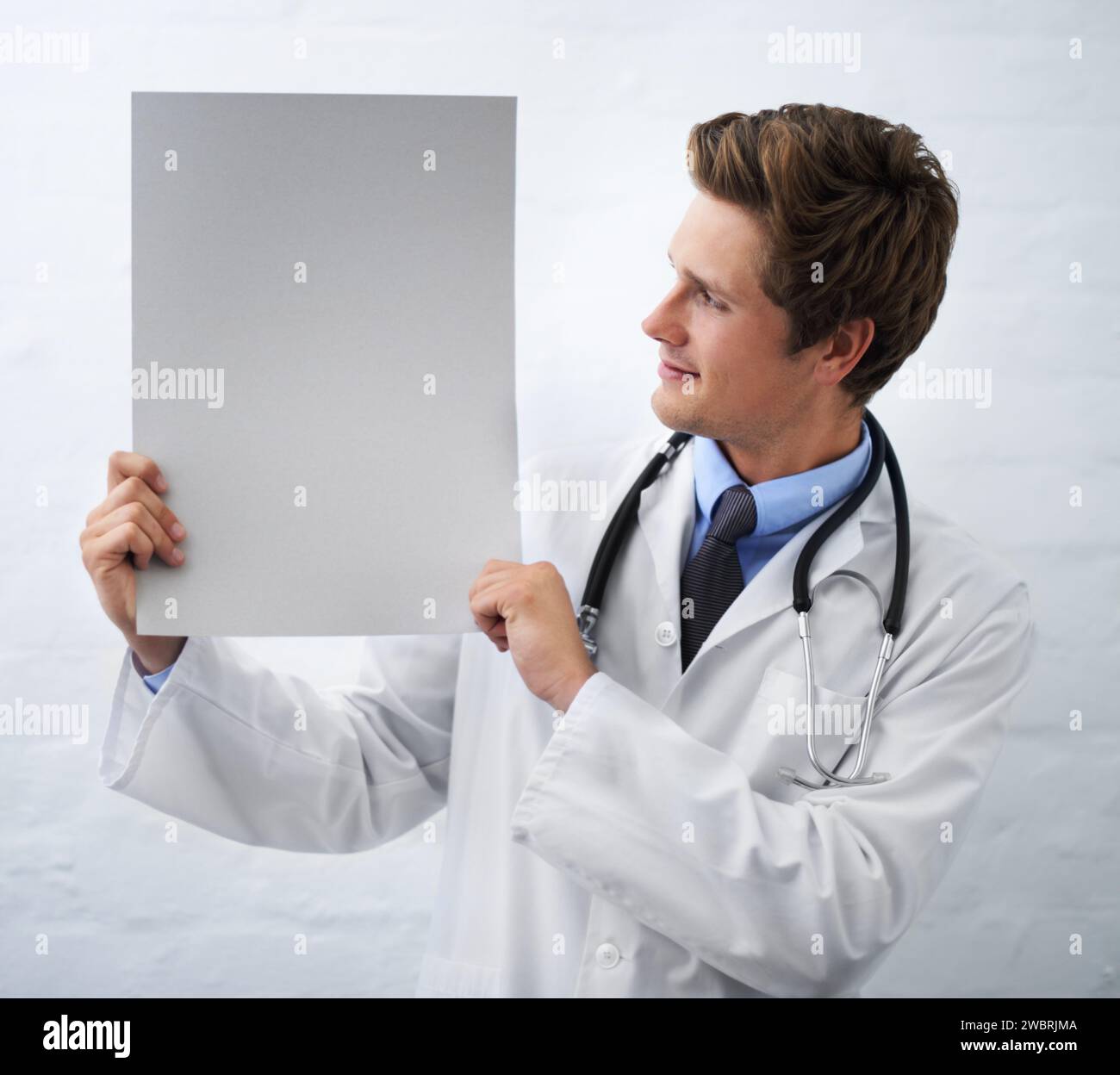 Man, doctor and billboard in healthcare for advertising or marketing on ...