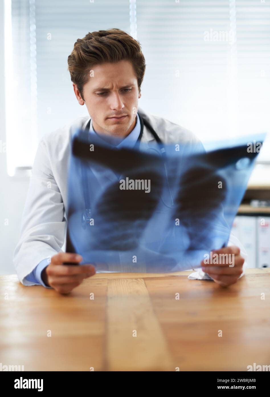 Man doctor in office and check xray, healthcare with medical diagnosis ...