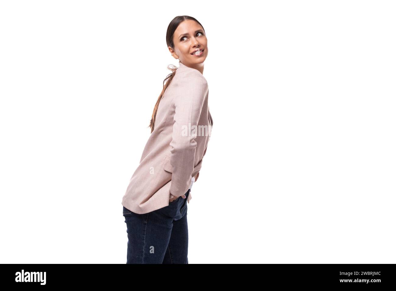 young slender caucasian woman with a ponytail hairstyle dressed in a ...
