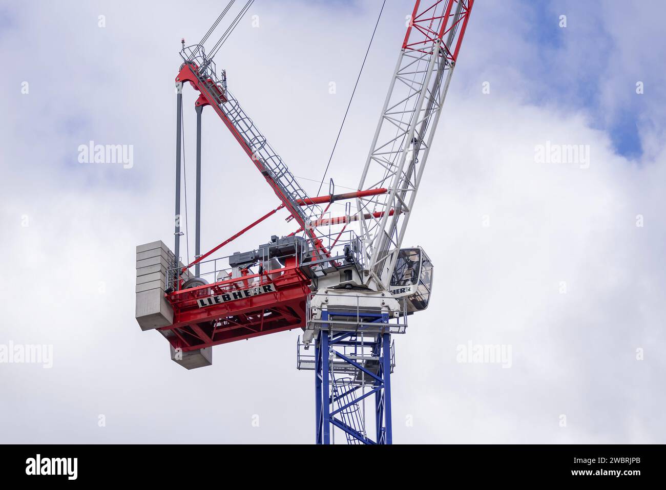 Ivry-sur-Seine, France - Blue, white and red luffing jib crane Liebherr ...