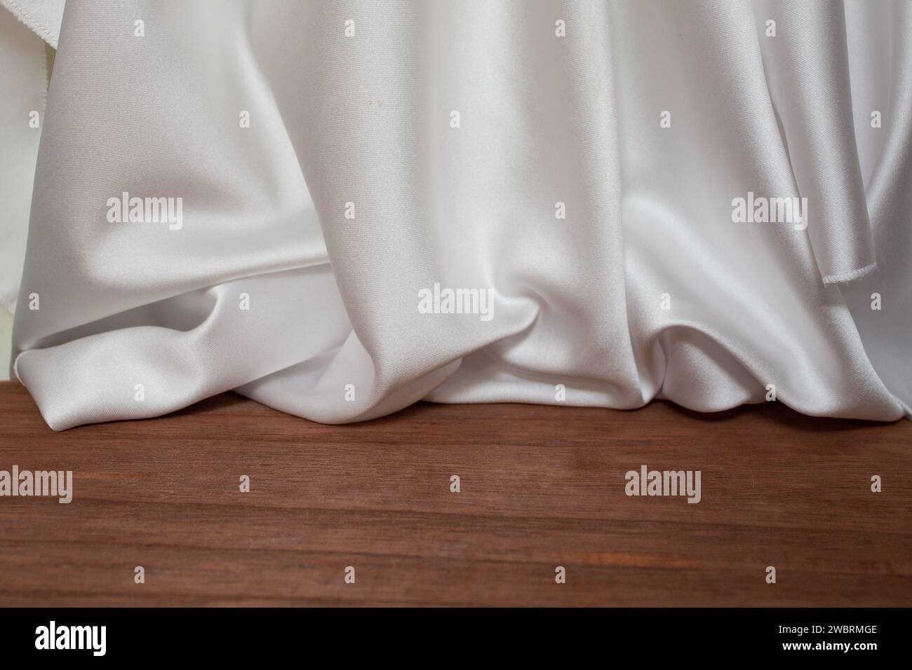 empty wooden floor with Elegant wavy white satin cloth curtains ...