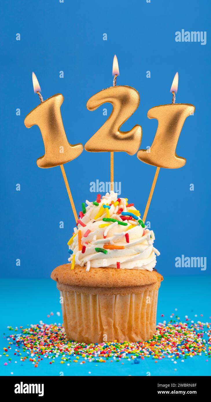 Candle number 121 - Cake birthday in blue background Stock Photo - Alamy
