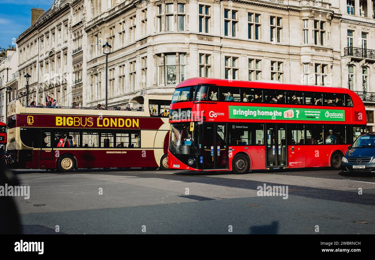 Two buses meet at the intersection in downtown London Stock Photo - Alamy