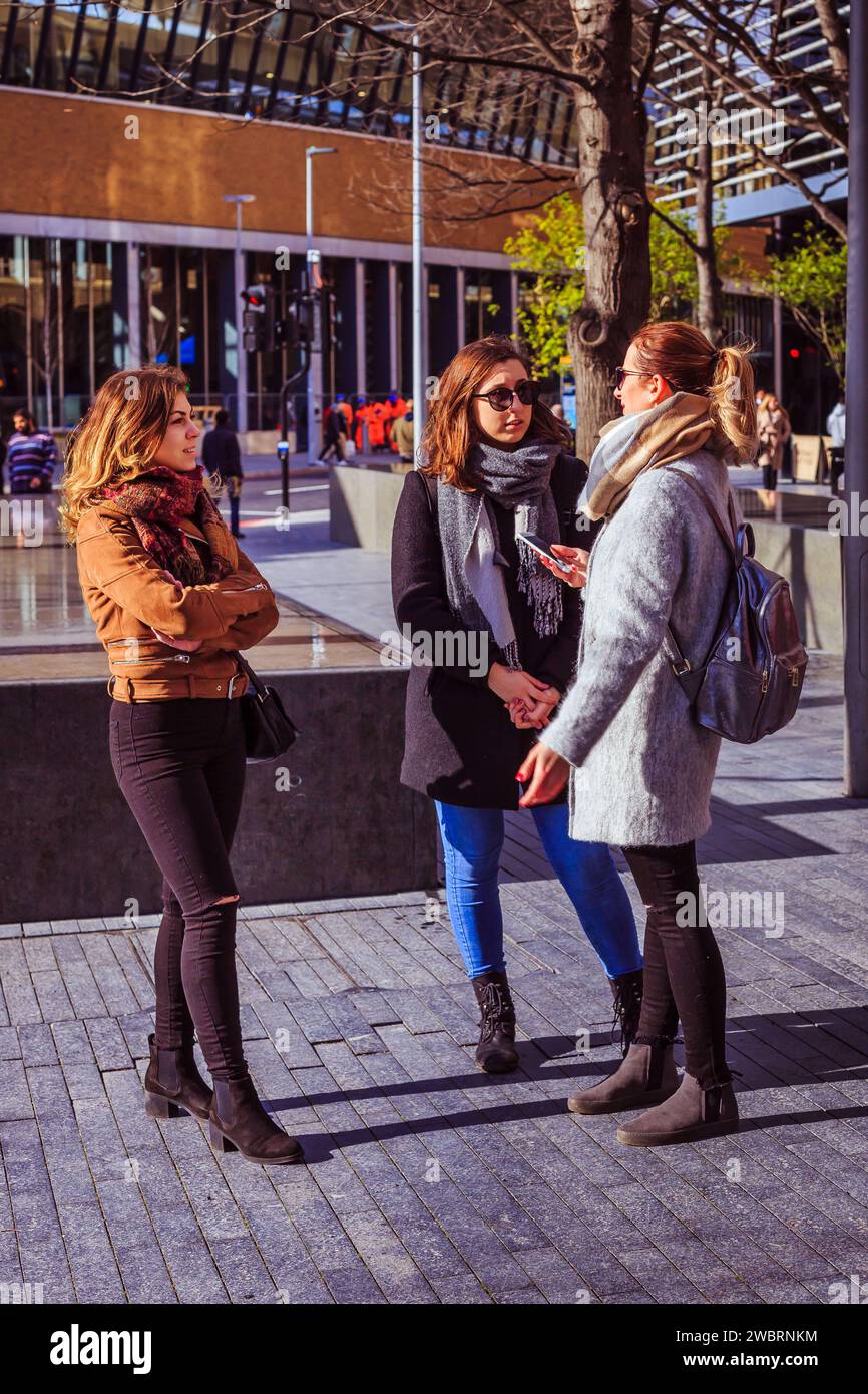 Three young ladies, tourists talking in London street Stock Photo - Alamy