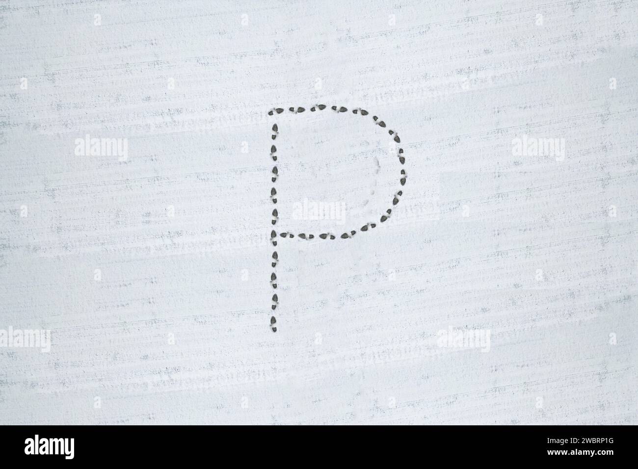 The letter P written in the snow. Winter writings Stock Photo - Alamy