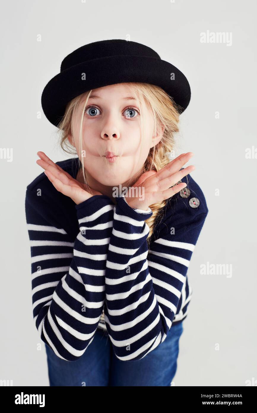 Fashion, goofy and girl child in a studio with casual, cool and stylish ...