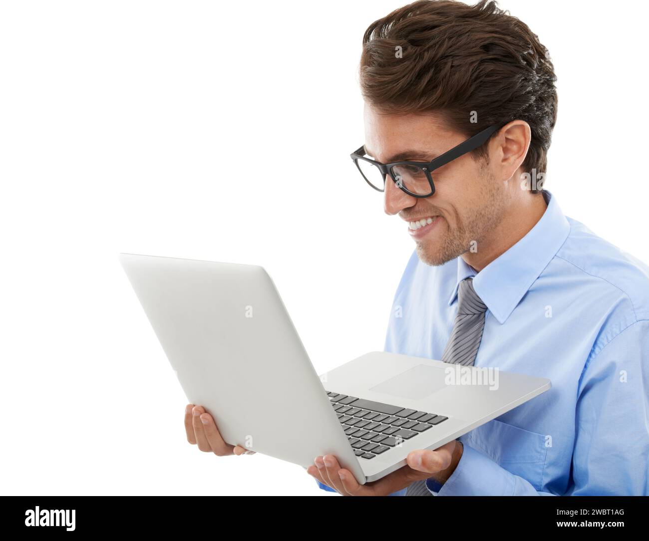 Happy businessman, laptop and reading email, social media or networking on a white studio ...