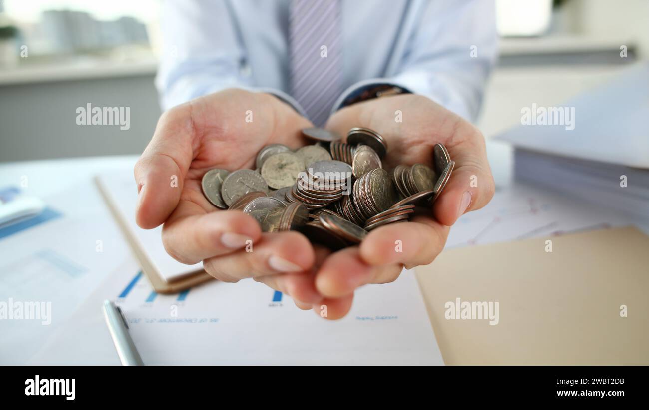 Hand businessman putting pin money Stock Photo - Alamy
