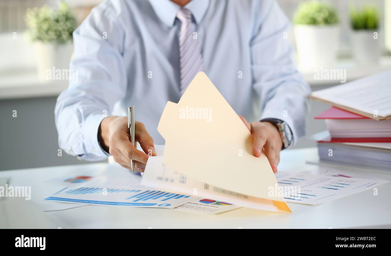 Male hands hold documents with financial Stock Photo - Alamy