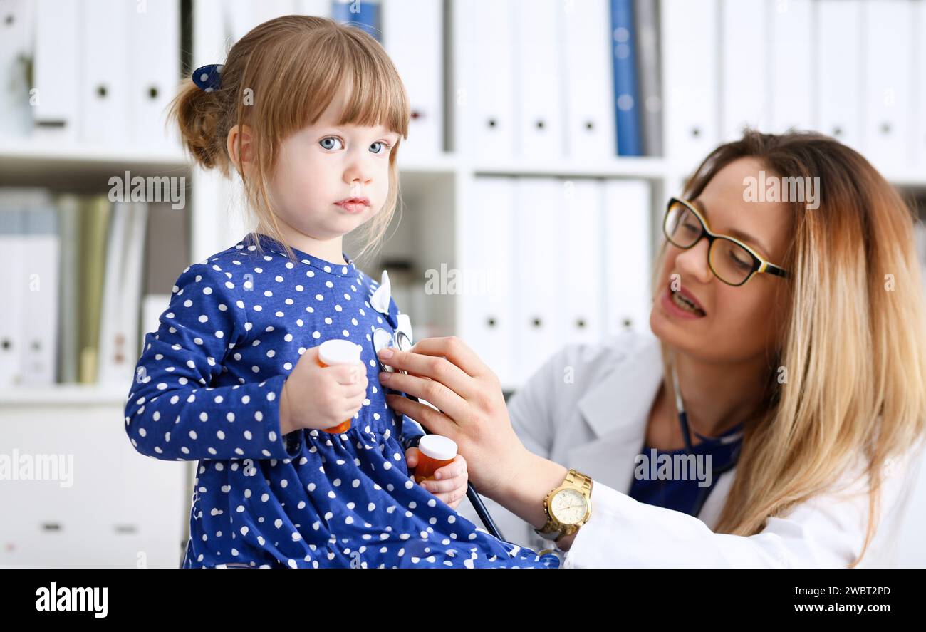 Little child with stethoscope at doctor reception Stock Photo - Alamy