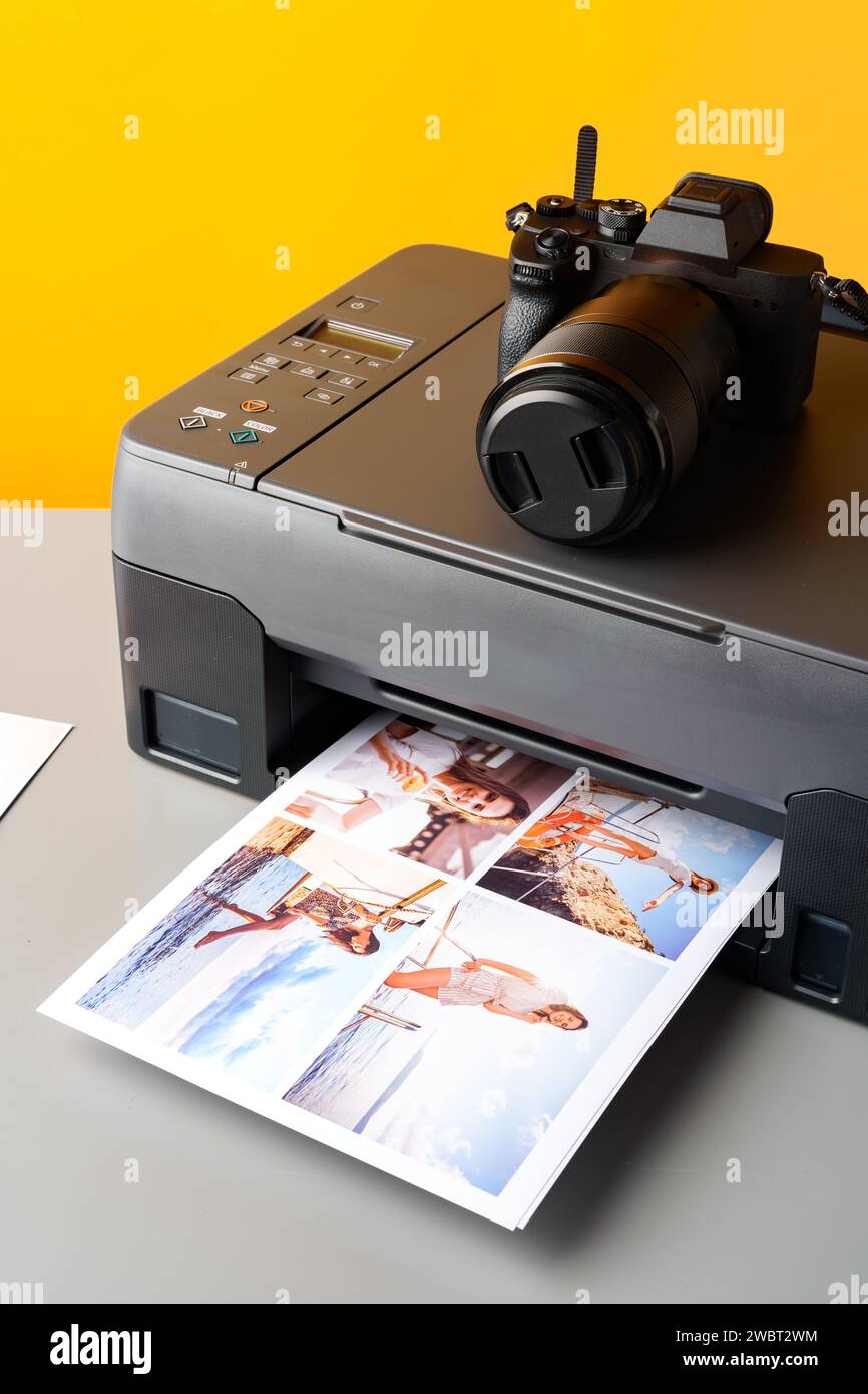 Printer and photo camera on table. Printing photos concept Stock Photo ...
