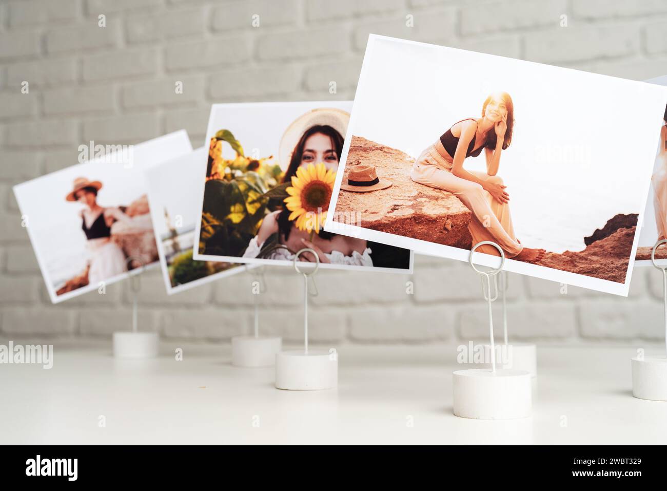 Printed colorful photos of women portraits. Printing photos concept ...