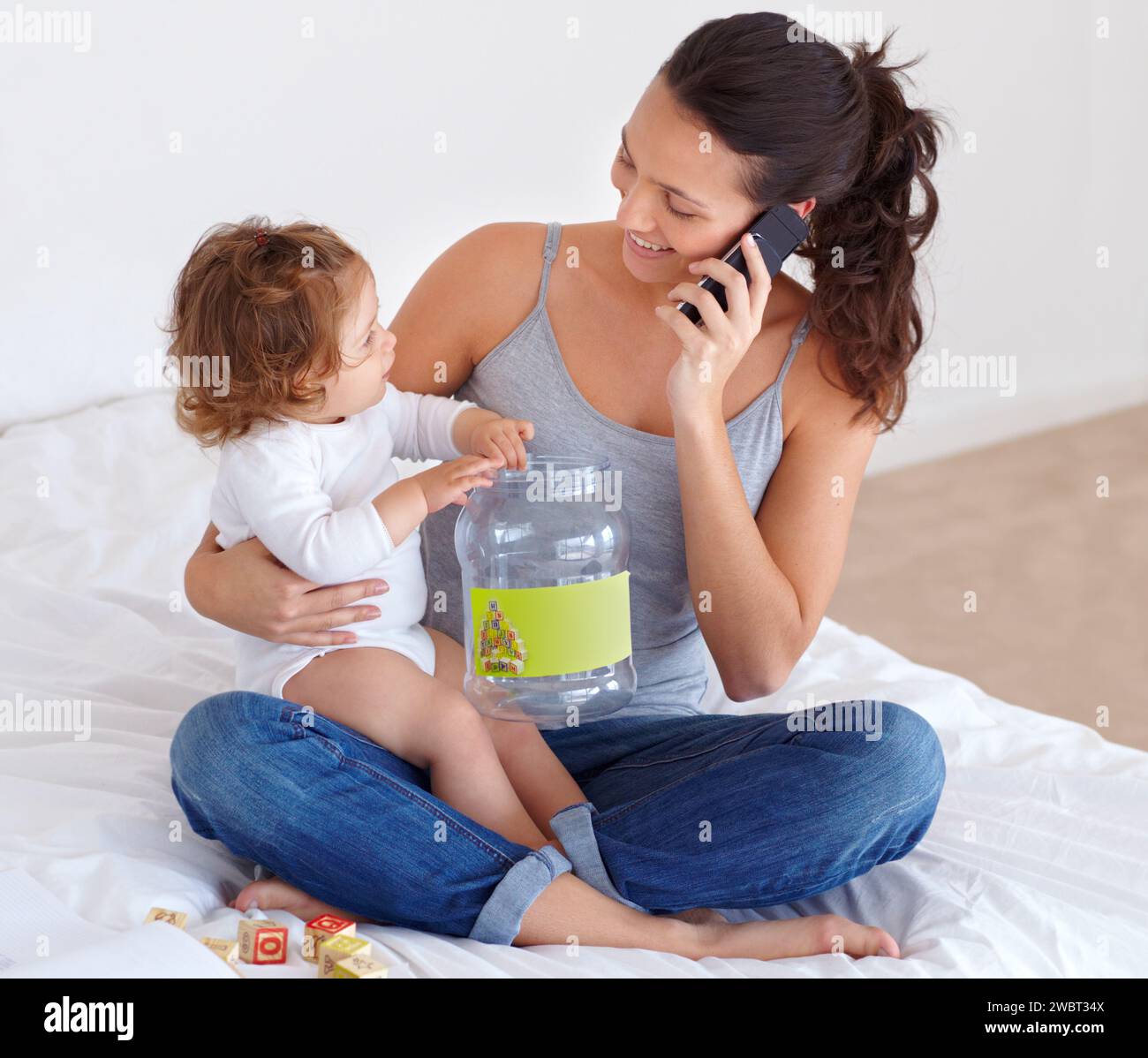 Happy, mom and phone call with baby in home talking on bed with child ...