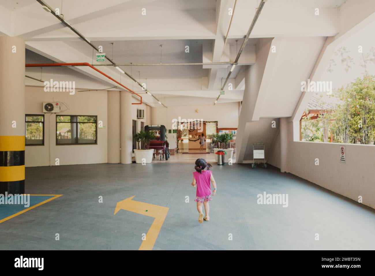 child running in the building parking lot Stock Photo - Alamy