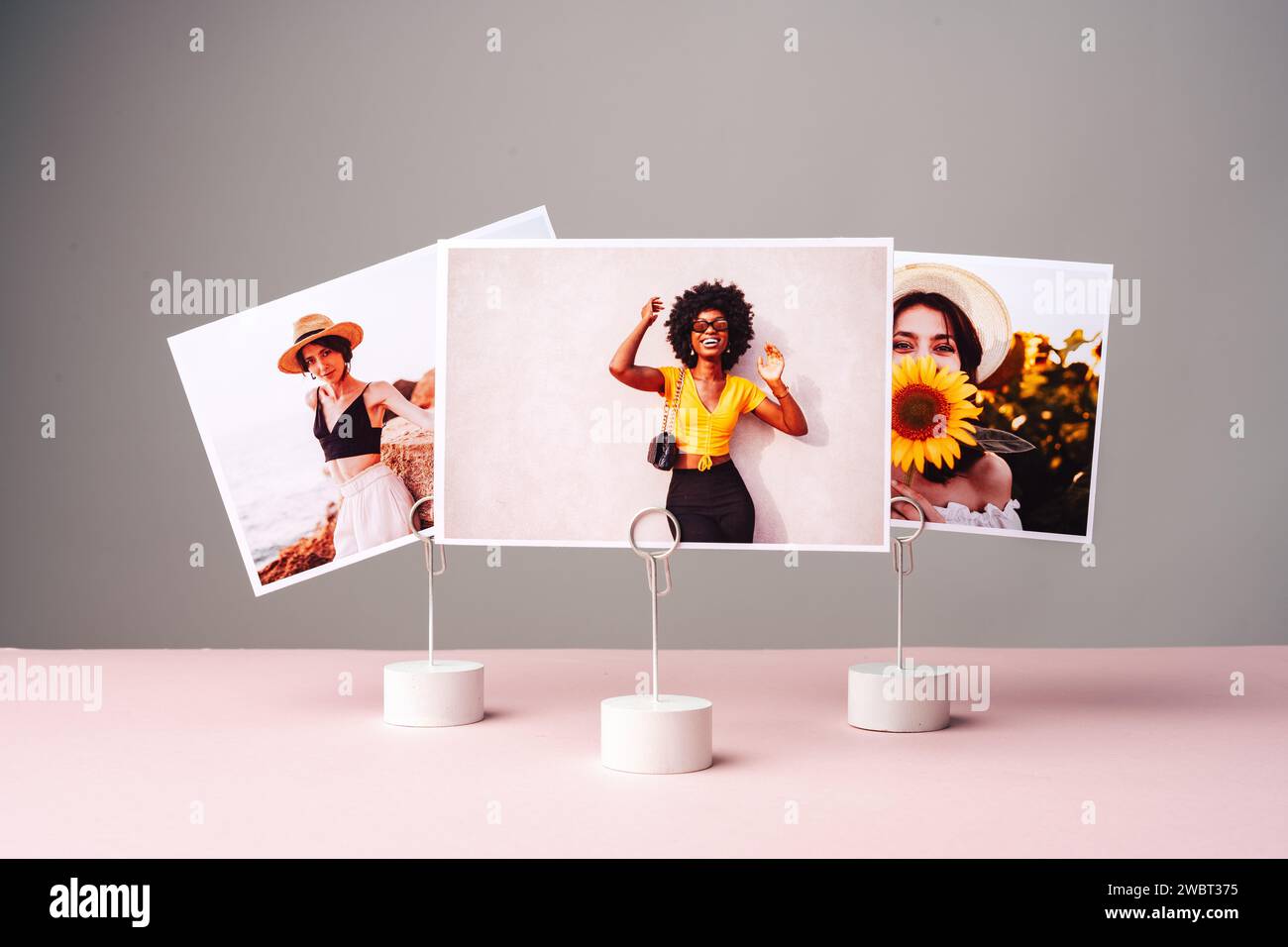 Printed colorful photos of women portraits against gray background ...