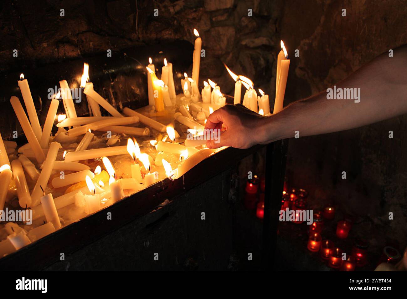 Man lighting a candle hi-res stock photography and images - Alamy
