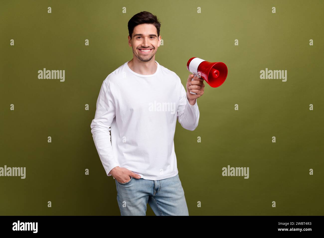 Photo of cheerful man promoter advertising new clothes advert market in ...