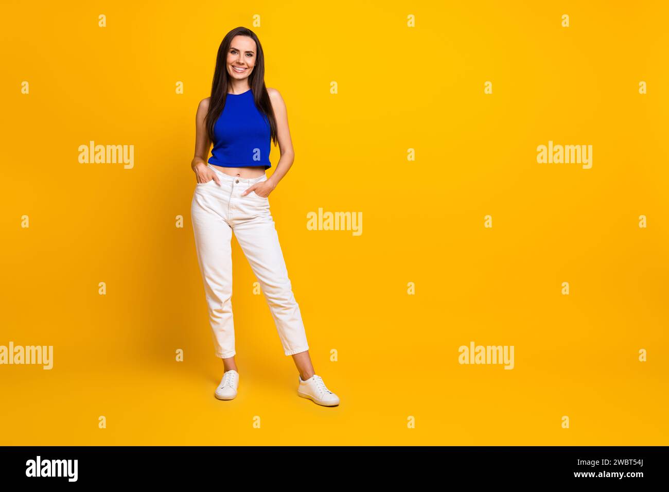 Full length photo of positive shiny lady dressed blue top smiling empty ...