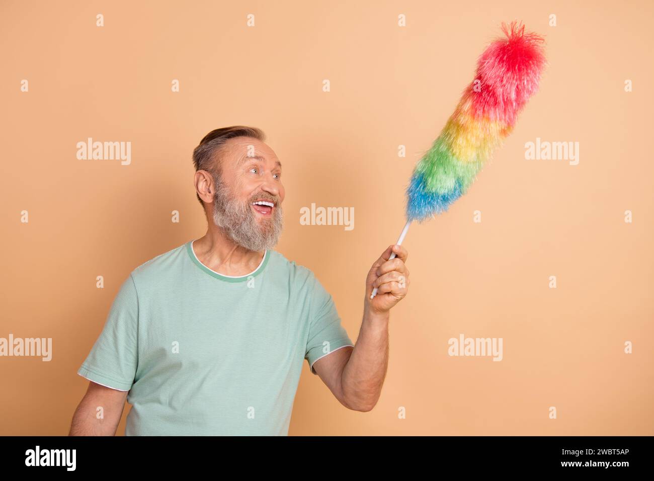 Photo of cheerful overjoyed person arm hold duster wipe empty space ...