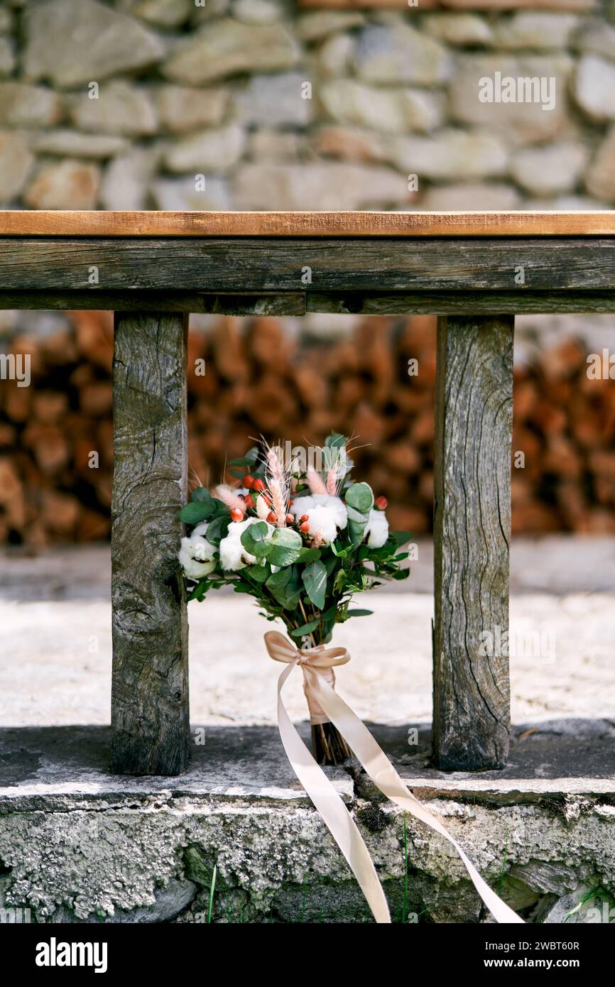 Wooden bench near flowers hi-res stock photography and images - Alamy