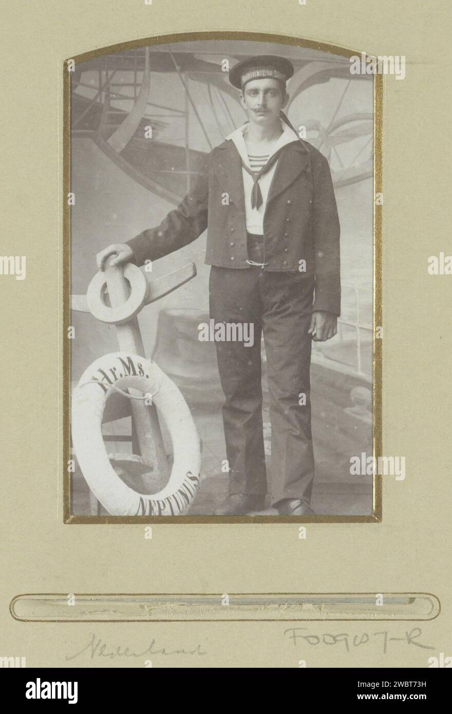 Portrait of a sailor of the Royal Netherlands Navy, standing next to a ...