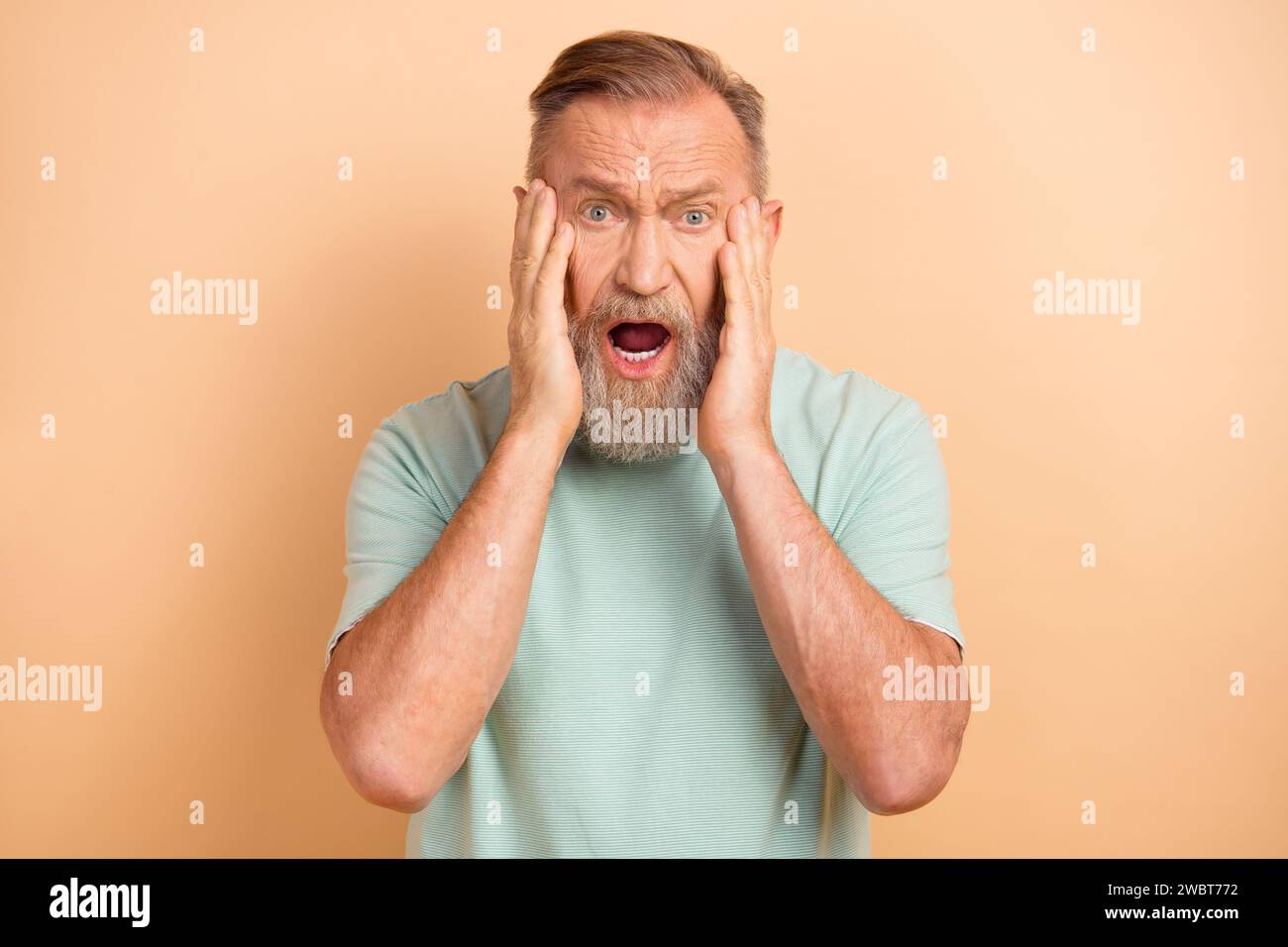 Photo of anxious embarrassed man open mouth touch face panic stupor ...