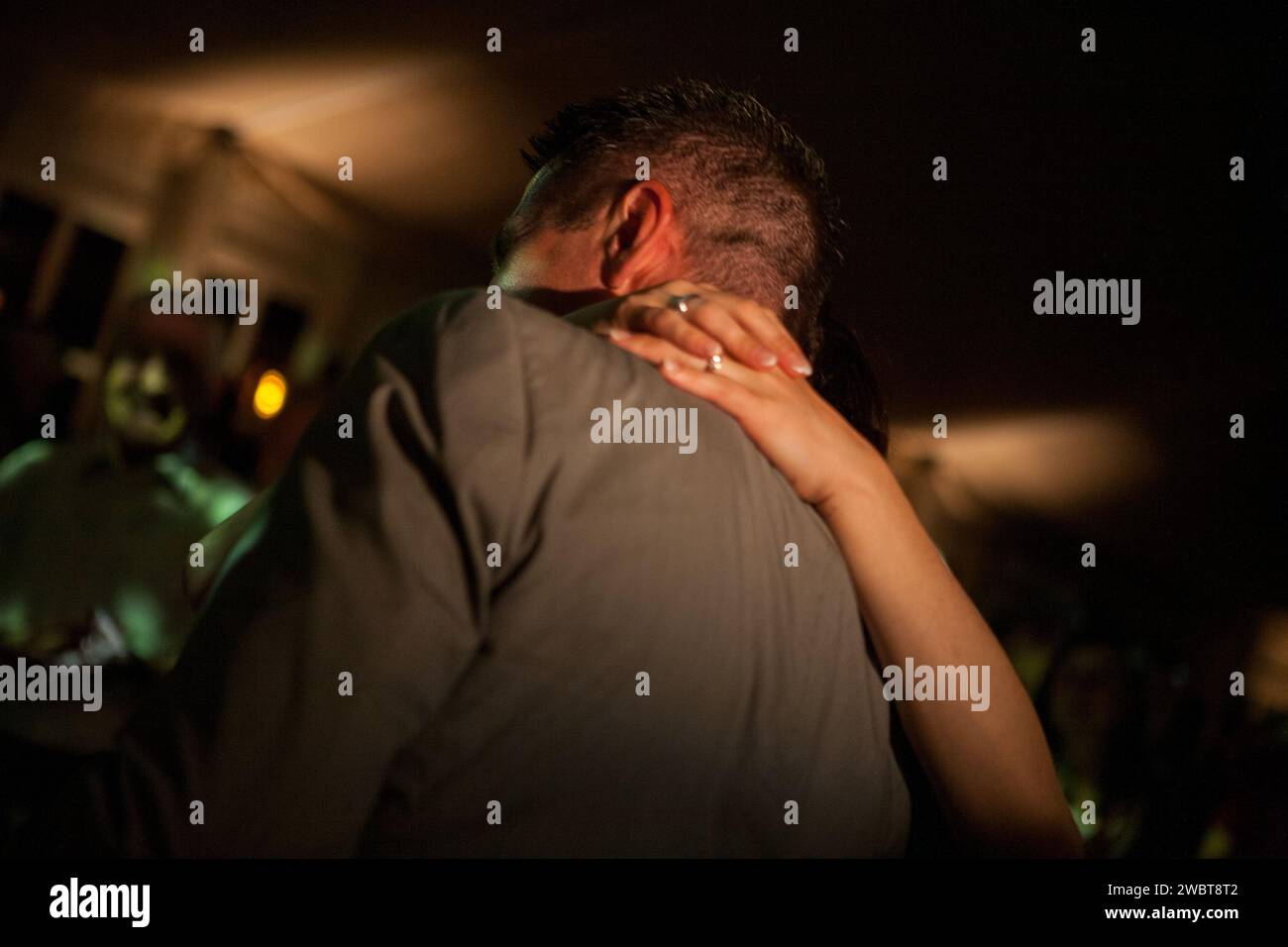 This photograph captures a tender moment between two individuals ...