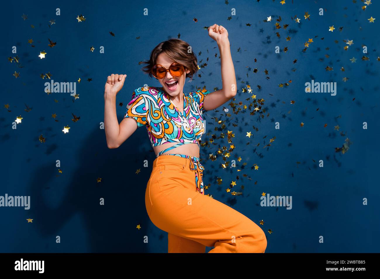 Photo portrait of lovely young lady celebrate victory dancing dressed ...