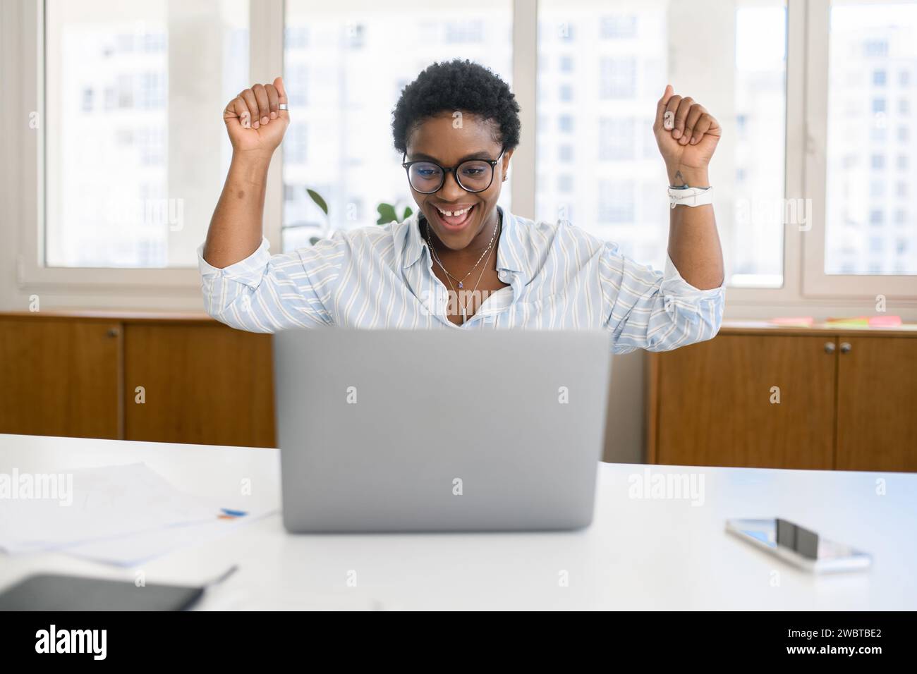 Excited female celebrating winning achieve hi-res stock photography and ...